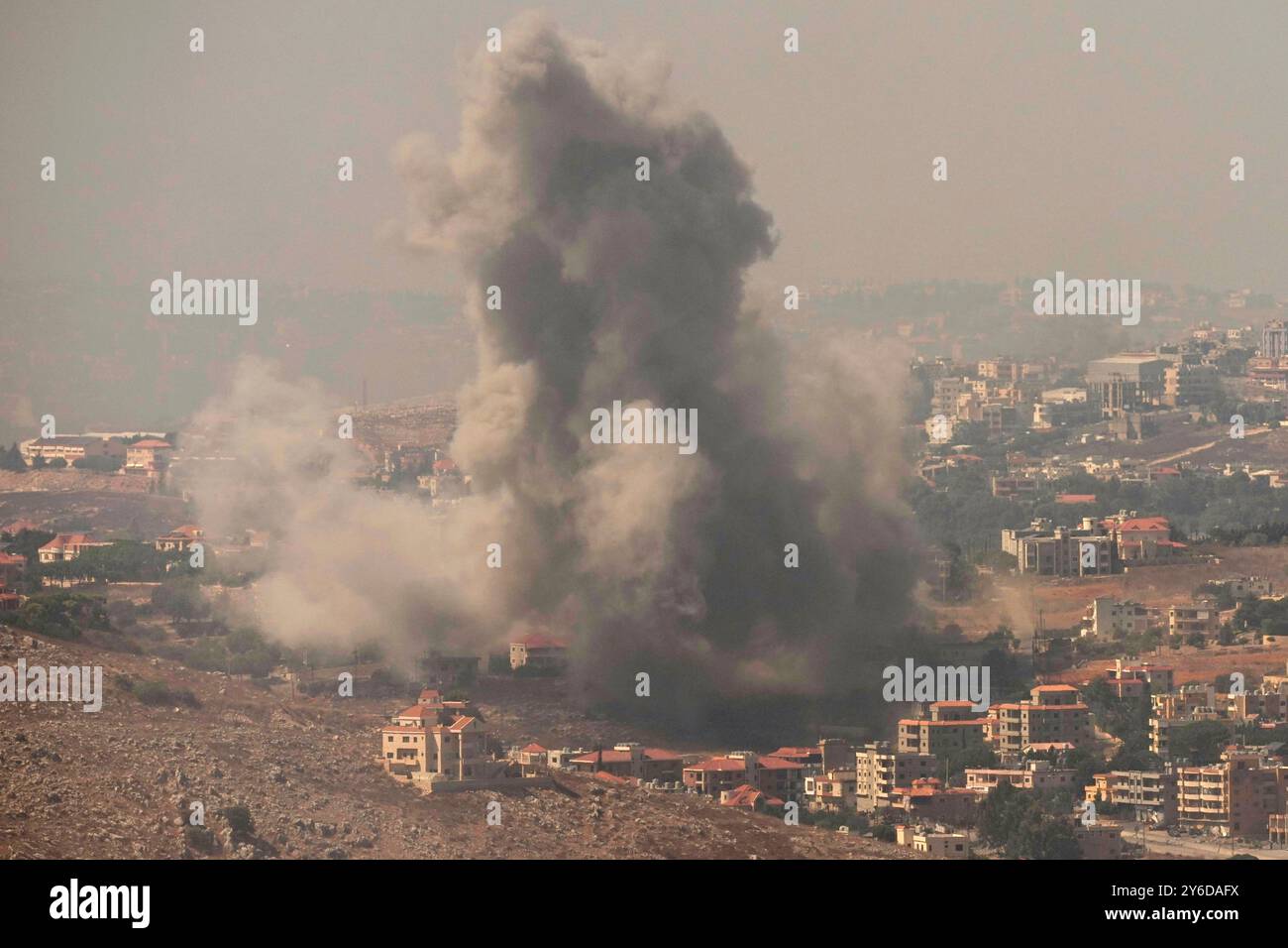 Smoke rises from Israeli airstrikes in the southern village of Kfar ...
