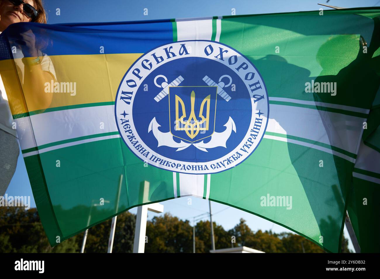Flag of Ukrainian Marine Border Guards at public demonstration. Women ...
