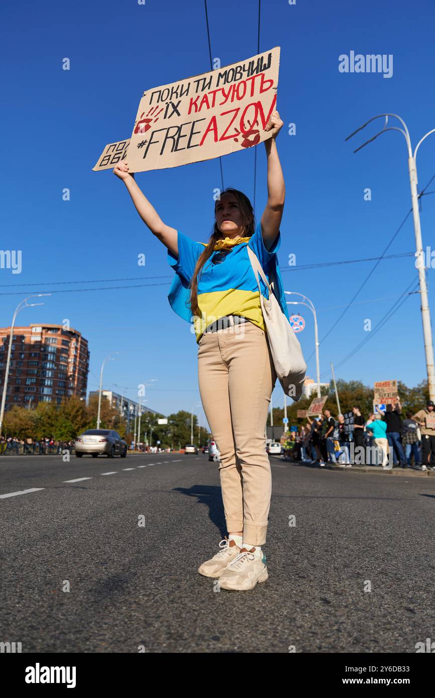 Ukrainian woman demonstrating with a sign Free Azov in the street of ...