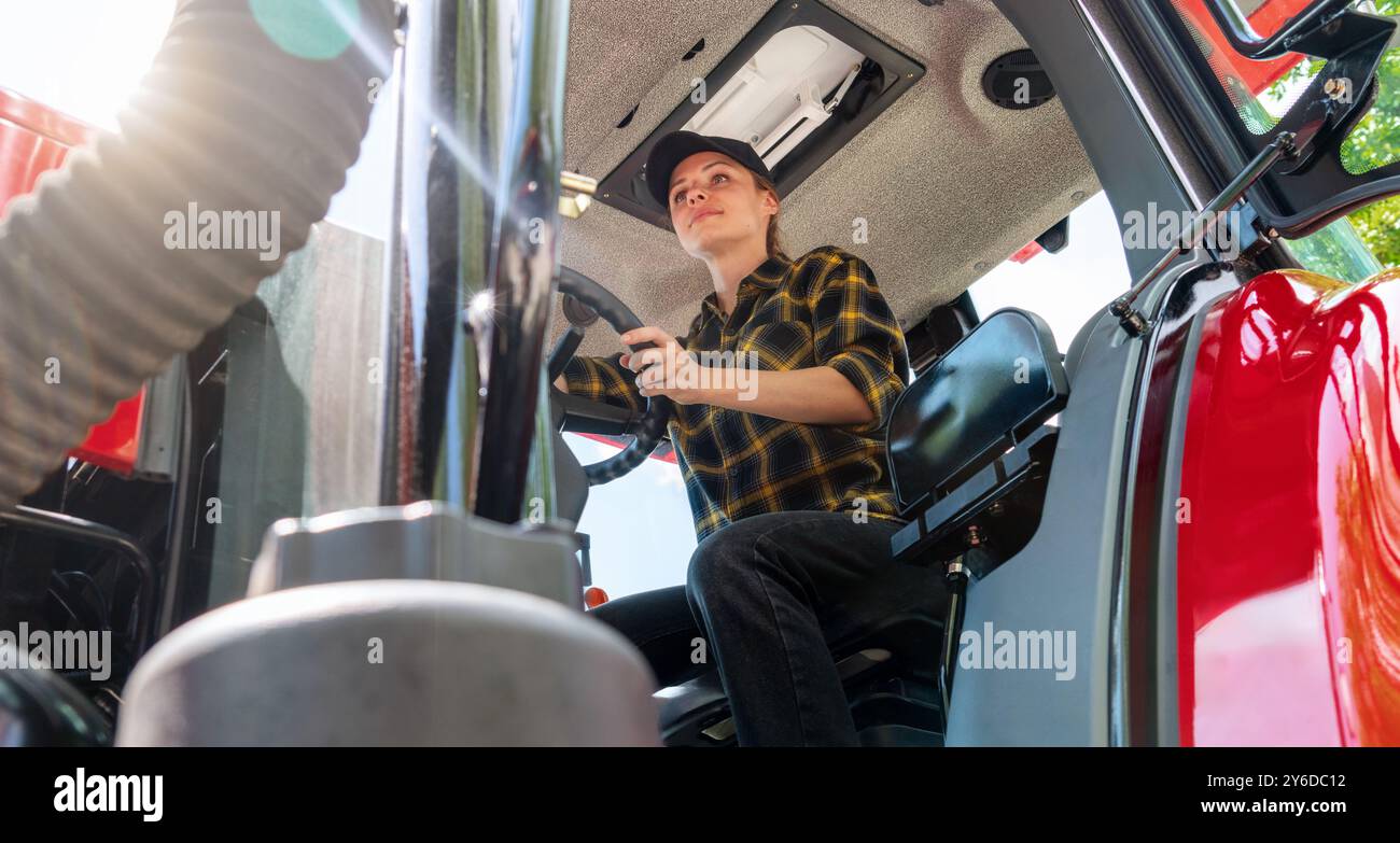 Woman driving tractor hi-res stock photography and images - Alamy