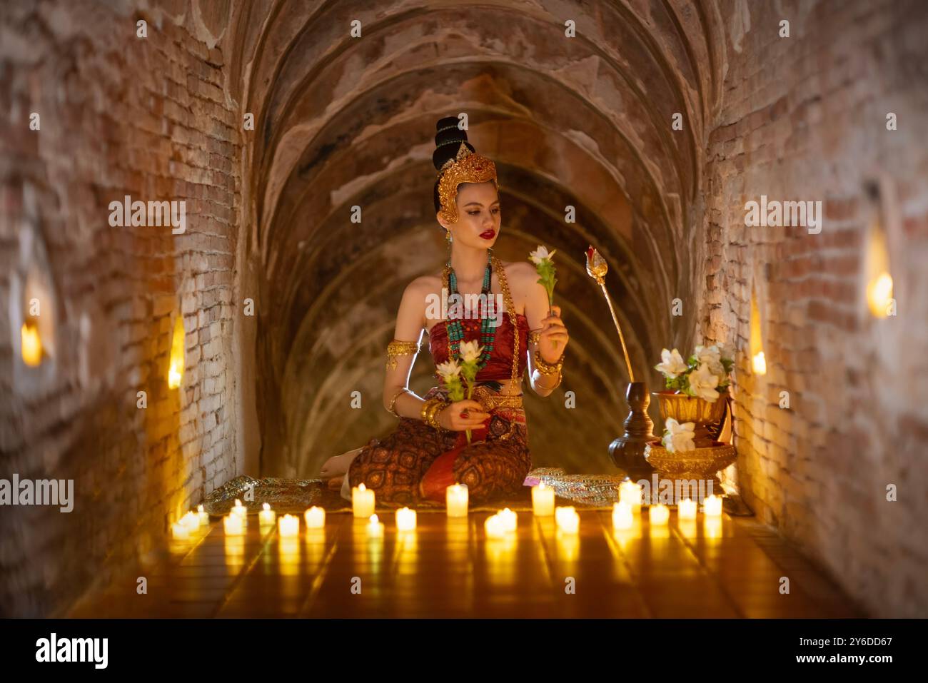 Beautiful young ASEAN woman in traditional Thai Dvaravati dress in an ...