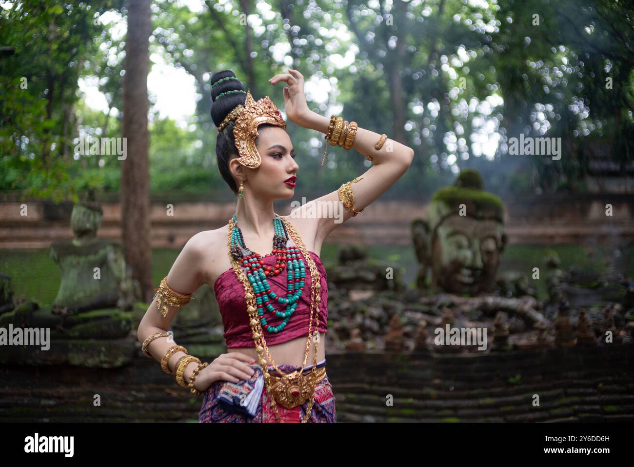 Beautiful young ASEAN woman in traditional Thai Dvaravati dress in an ...