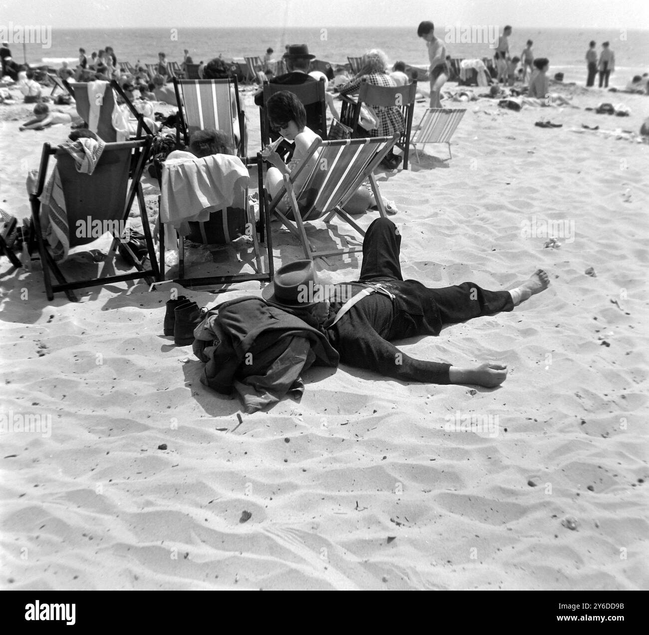 HOLIDAYS OLD MAN RELAXES IN THE SUN AT BOURNEMOUTH BEACH ; 1 JUNE 1963 ...
