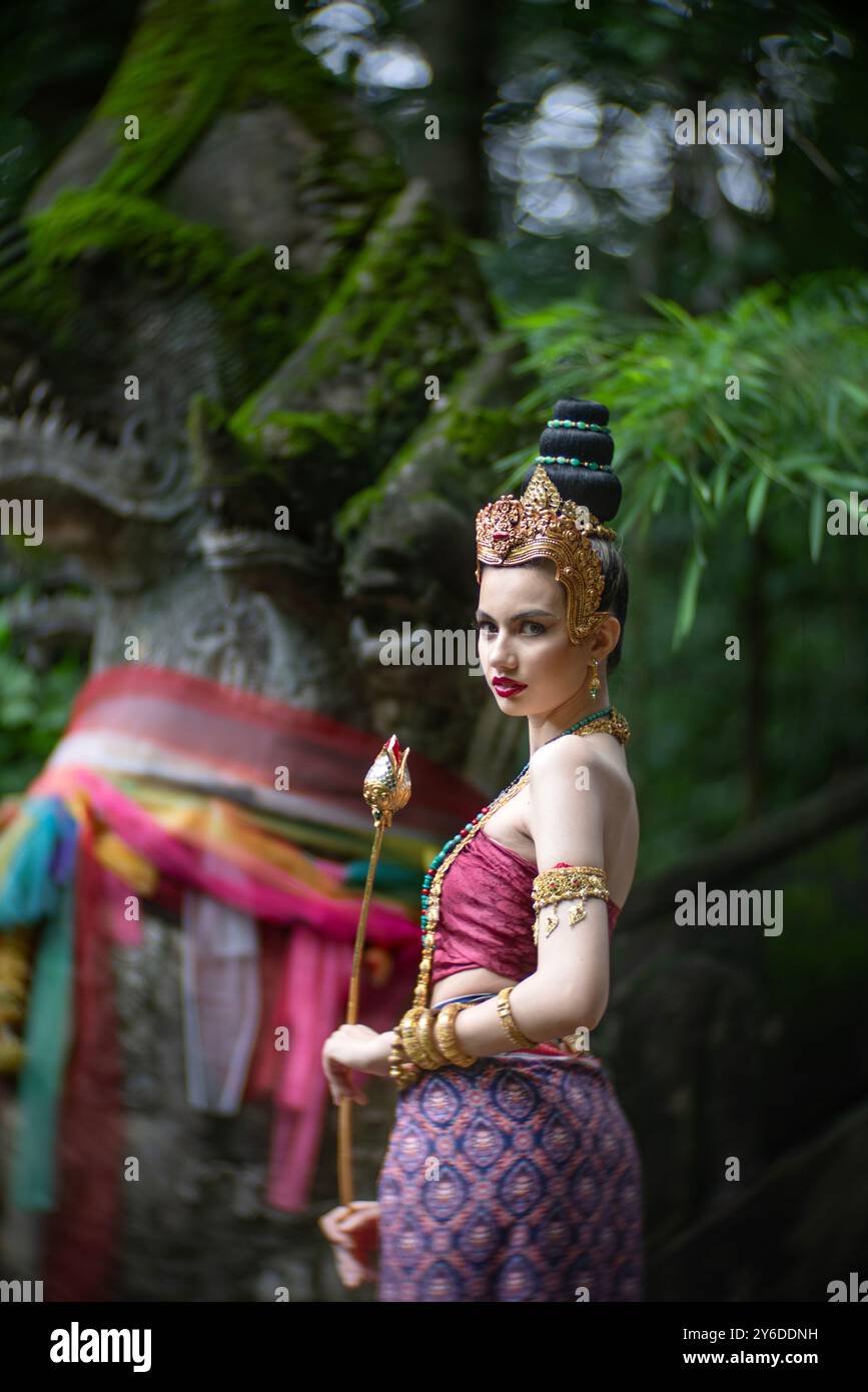 Beautiful young ASEAN woman in traditional Thai Dvaravati dress in an ...