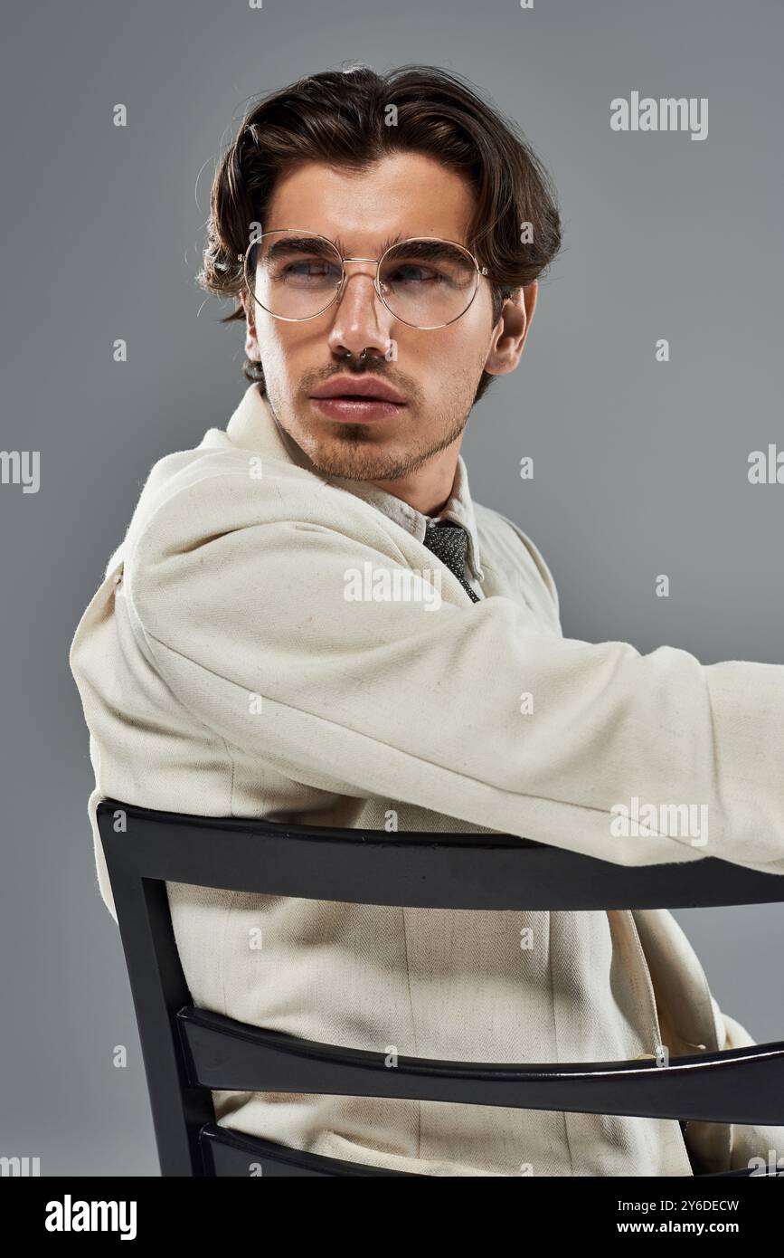 Young man in formal attire poses confidently hi-res stock photography ...