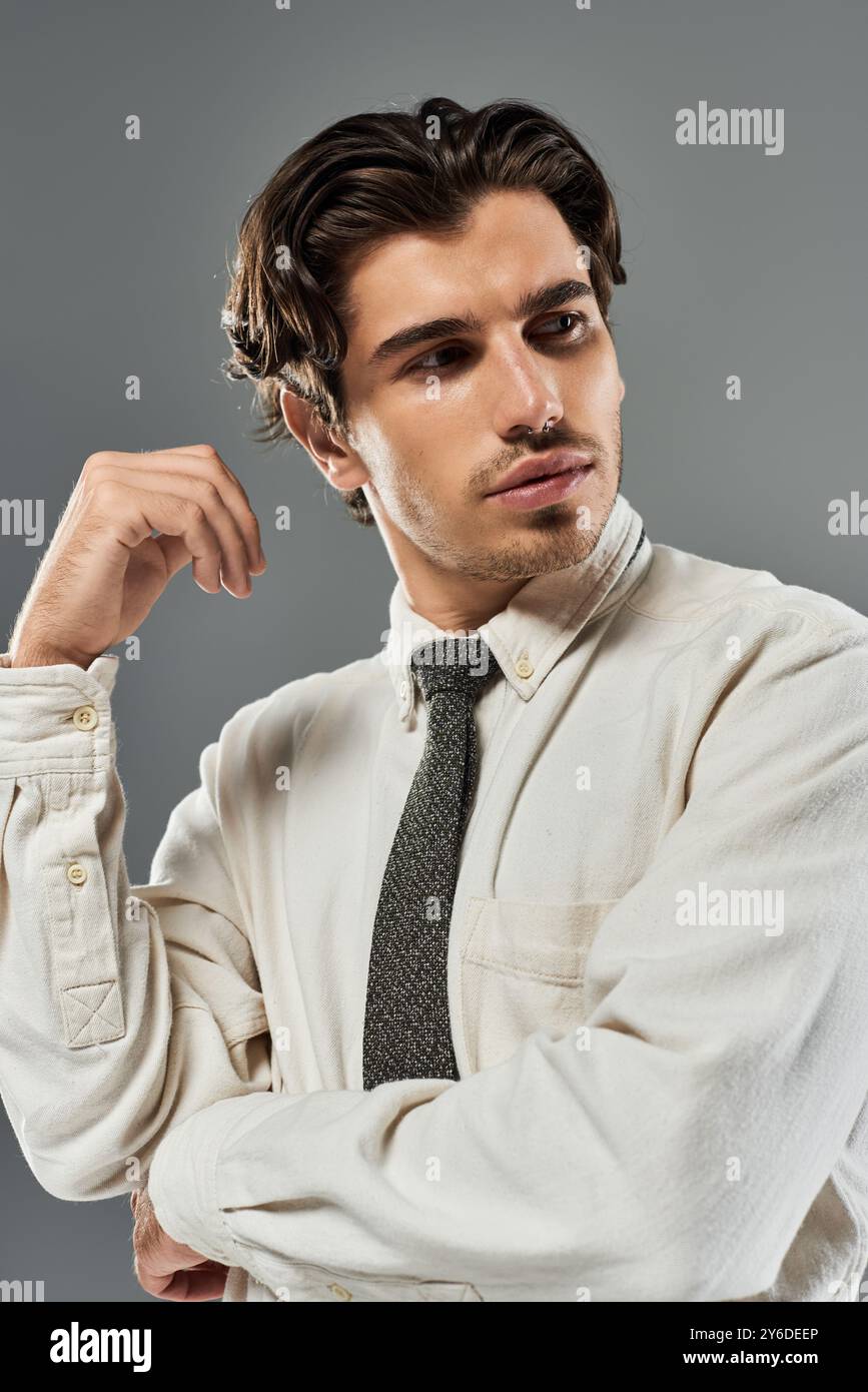 A handsome young man dressed in elegant formal wear showcases his ...