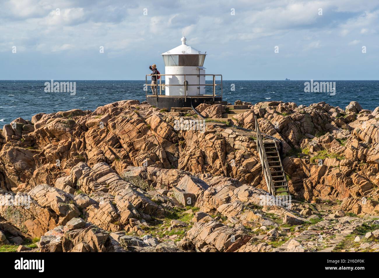 Small white lighthouse below Kullen lighthouse. Kullaberg a rocky ...