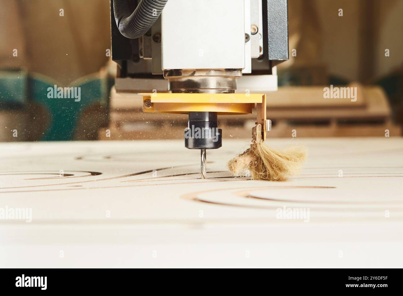 Cnc machine at carpentry workshop. Cutting wood with various router ...