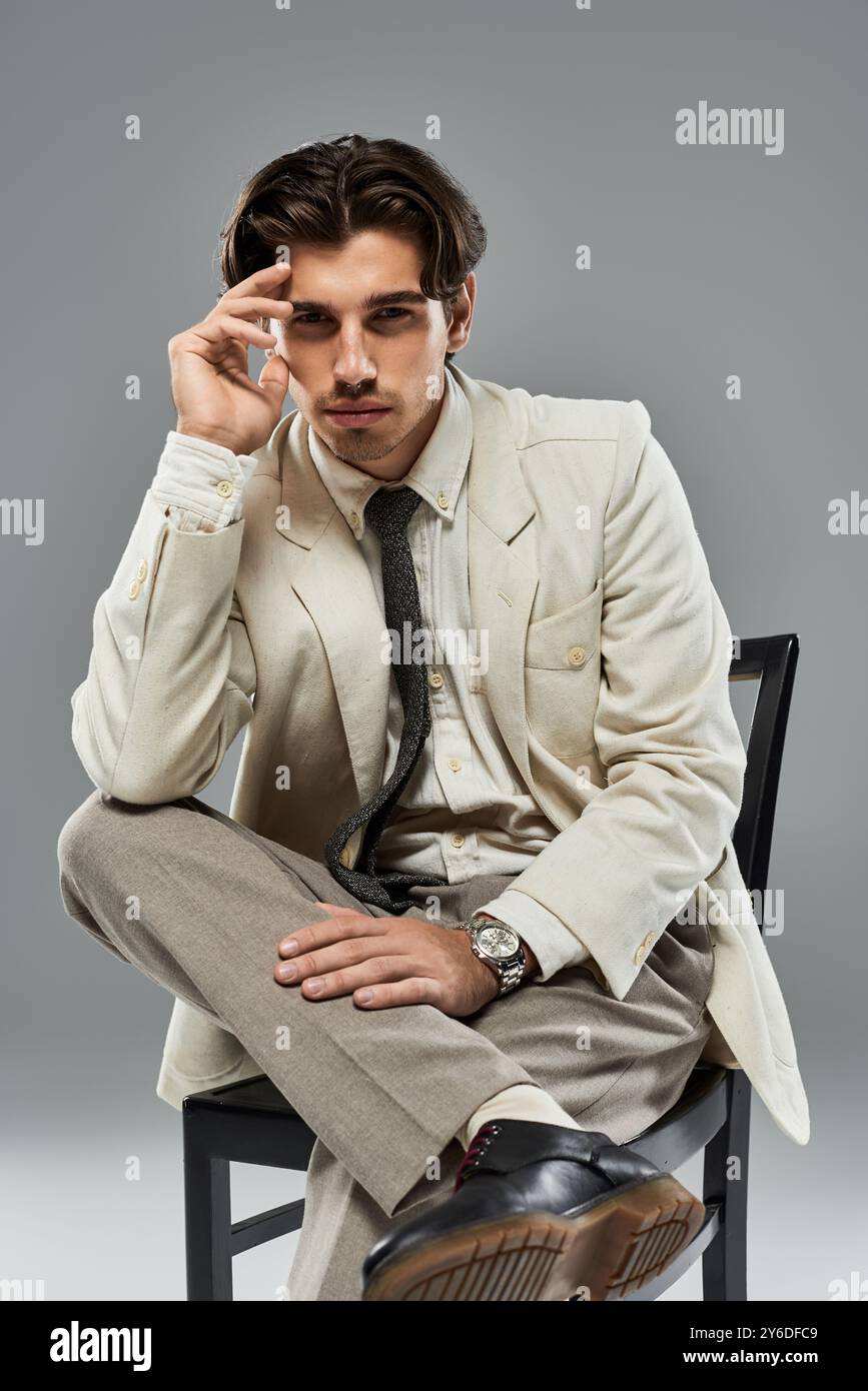 A dapper young man dressed in elegant formal wear poses confidently ...