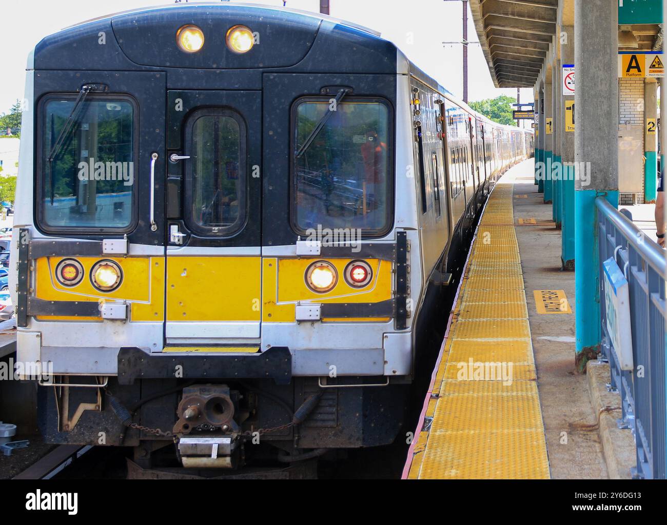 A Long Island Railroad train pulling into the eleveted train station in ...