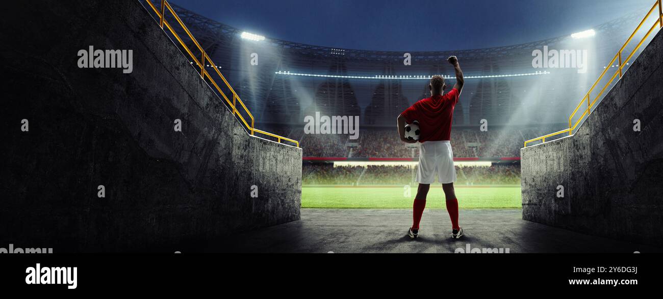 Victorious soccer player, dressed in red, from Portugal team standing ...