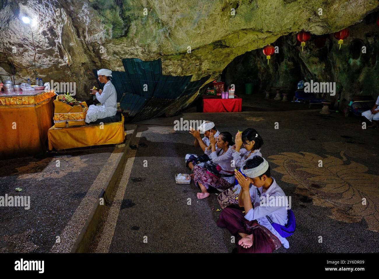 Indonesia, Bali, Nusa Penida, Worshippers praying in the cave of Goa ...