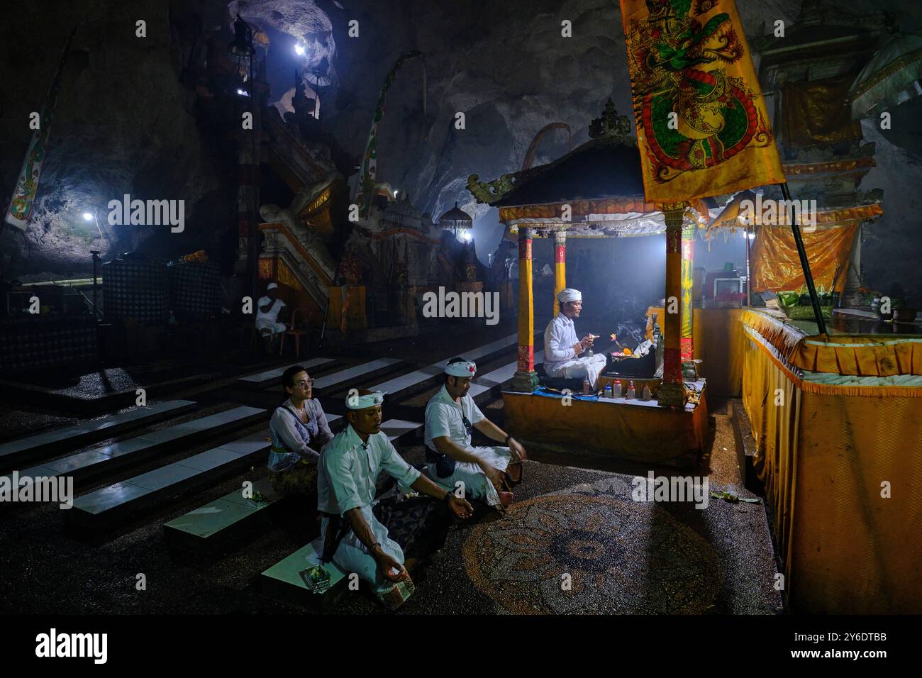 Indonesia, Bali, Nusa Penida, Worshippers praying in the cave of Goa ...