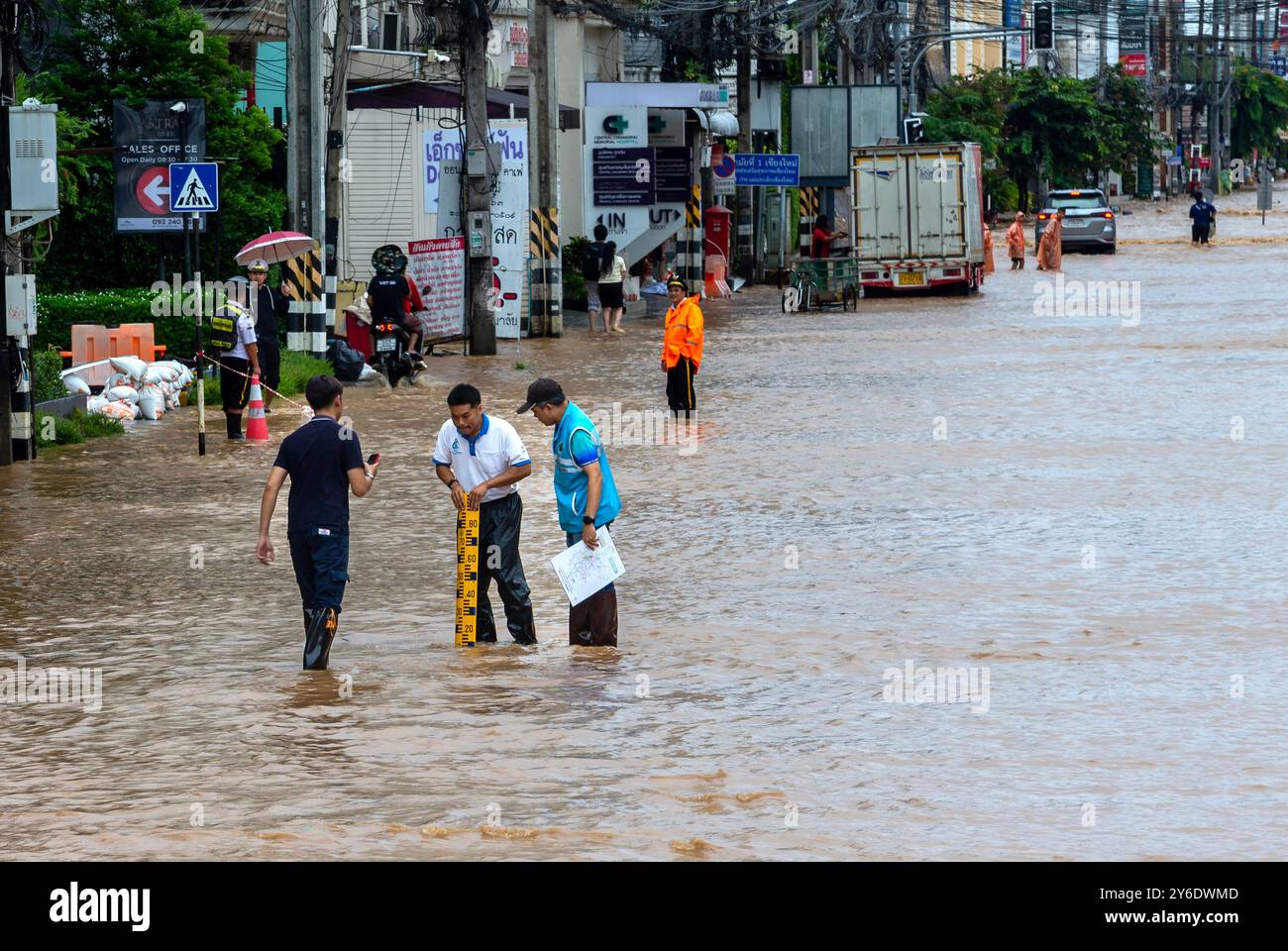 Officials from the Royal Irrigation Department are measuring the water ...