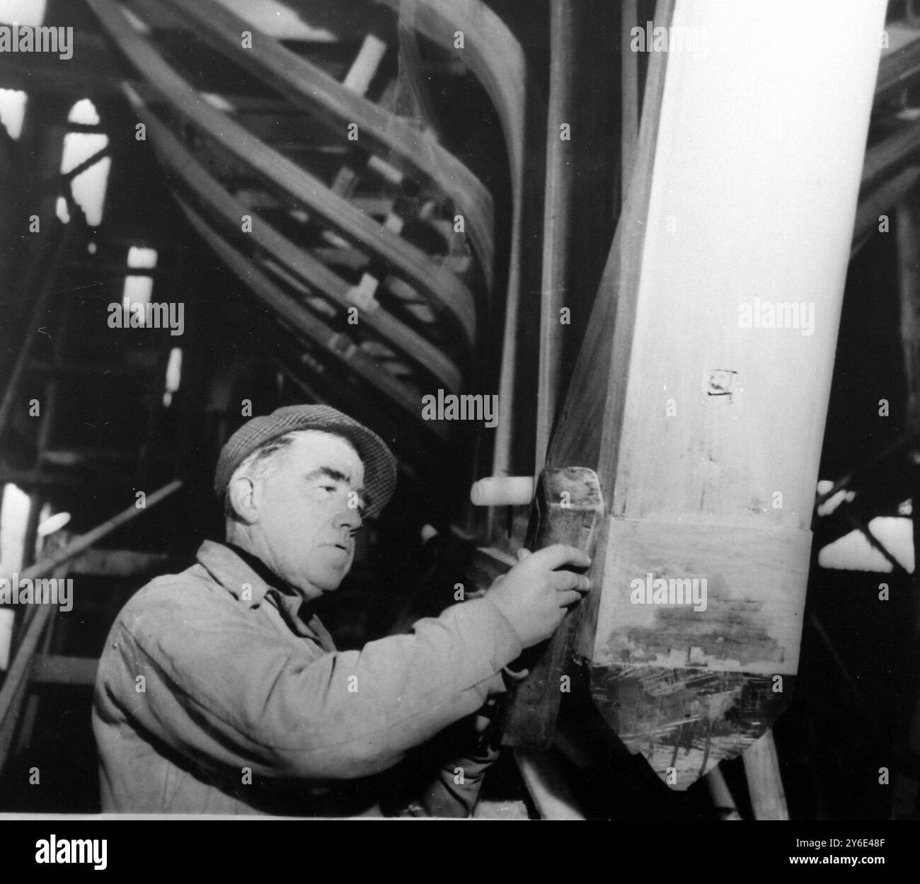 YACHTING SHIPWRIGHT IS PICTURED FARING THE STERN POST - YACHT BEING ...