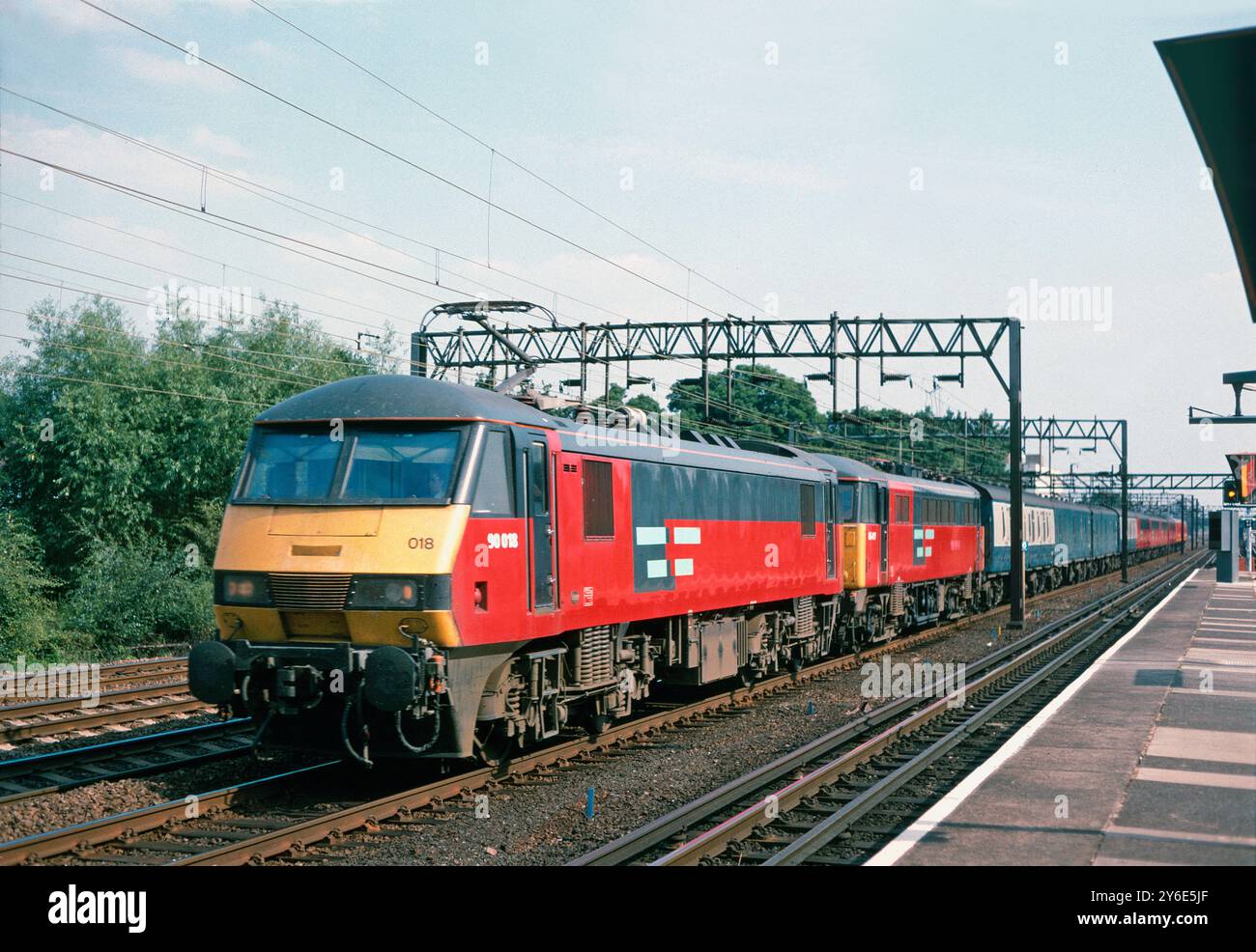 A Class 90 electric locomotive number 90018 with Class 86 number 86417 ...