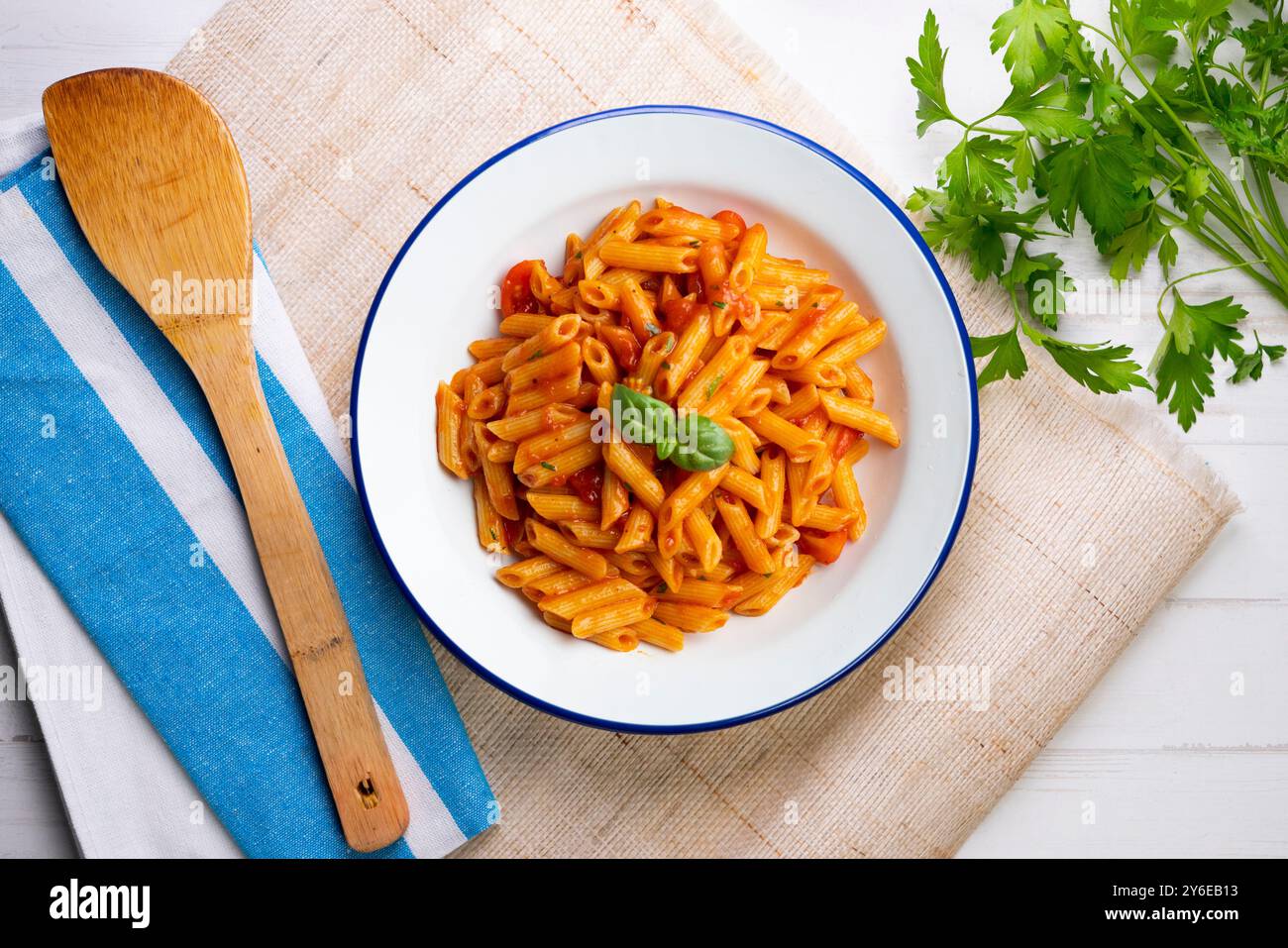 Macaroni with tomato and basil aroma. Top view table with decorations Stock Photo - Alamy
