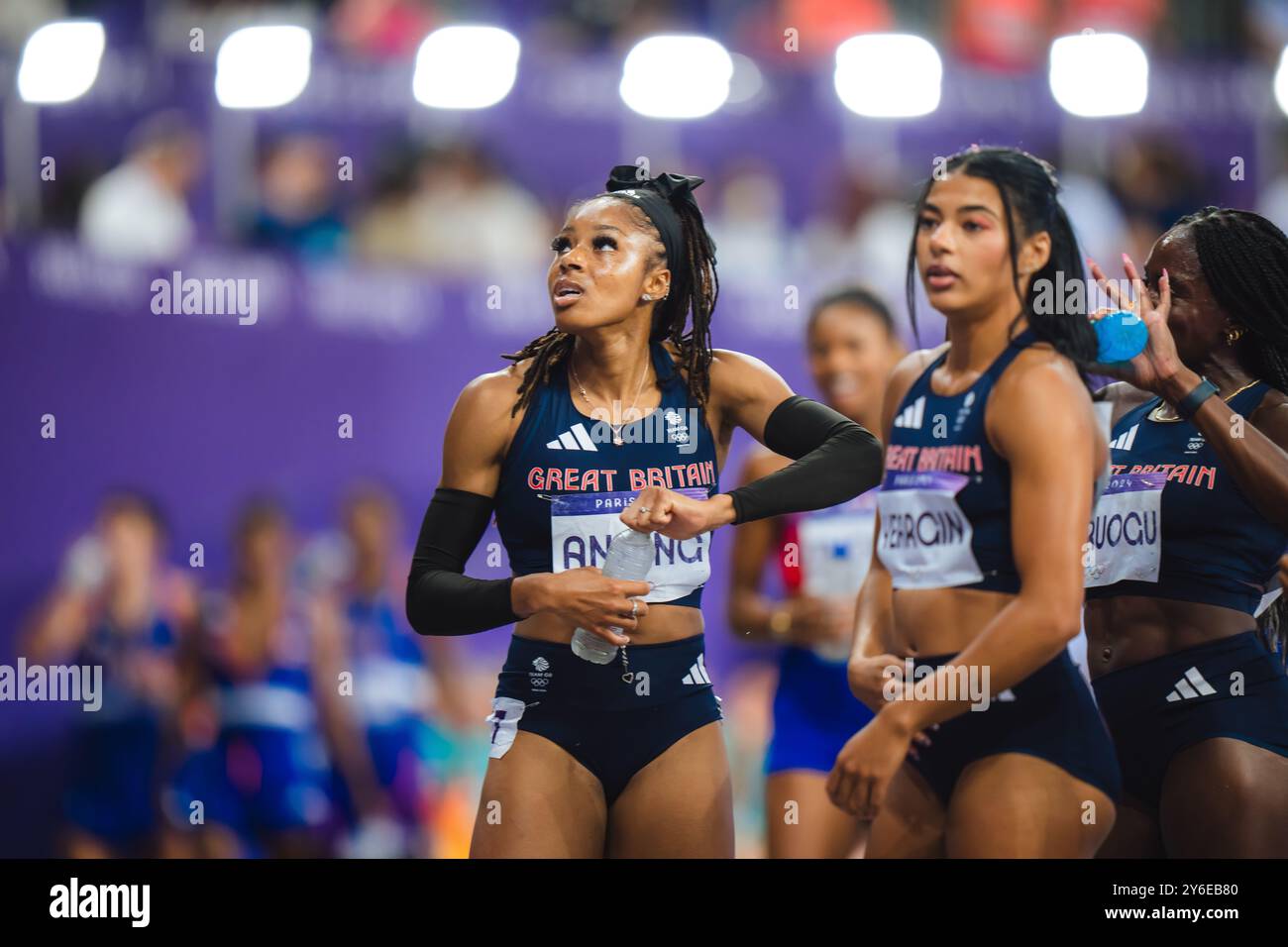 Amber Anning participating in the 4X400 meters relay at the Paris 2024 ...
