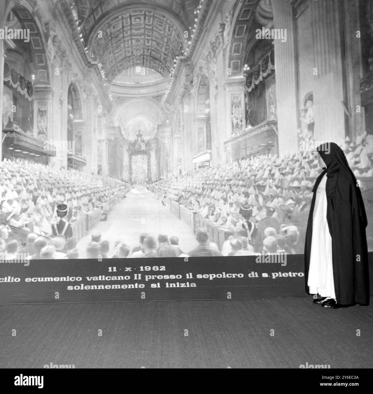 A NUN WITH A HUGE PAINTING OF ST PETERS BASILICA IN ROME ; 20 NOVEMBER ...