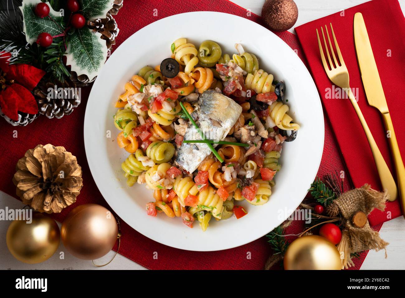 Italian pasta with sardines and black olives. Top view table with ...