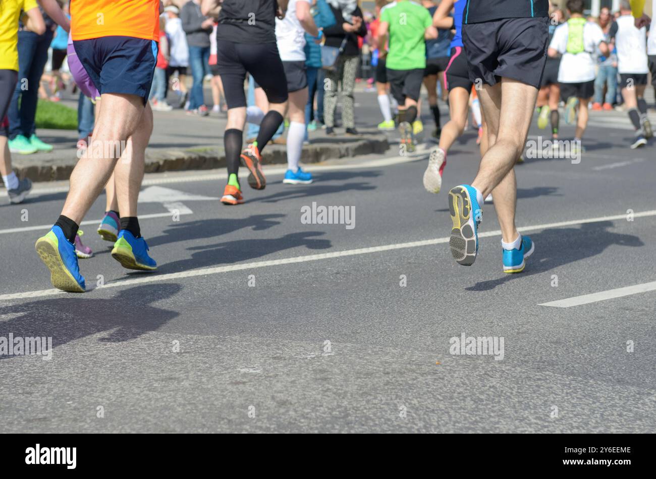 Marathon running race, many runners feet on road racing, sport ...