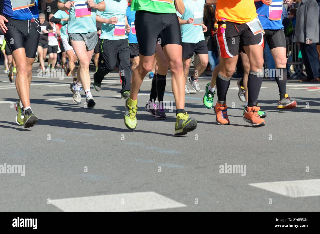 Marathon running race, many runners feet on road racing, sport ...