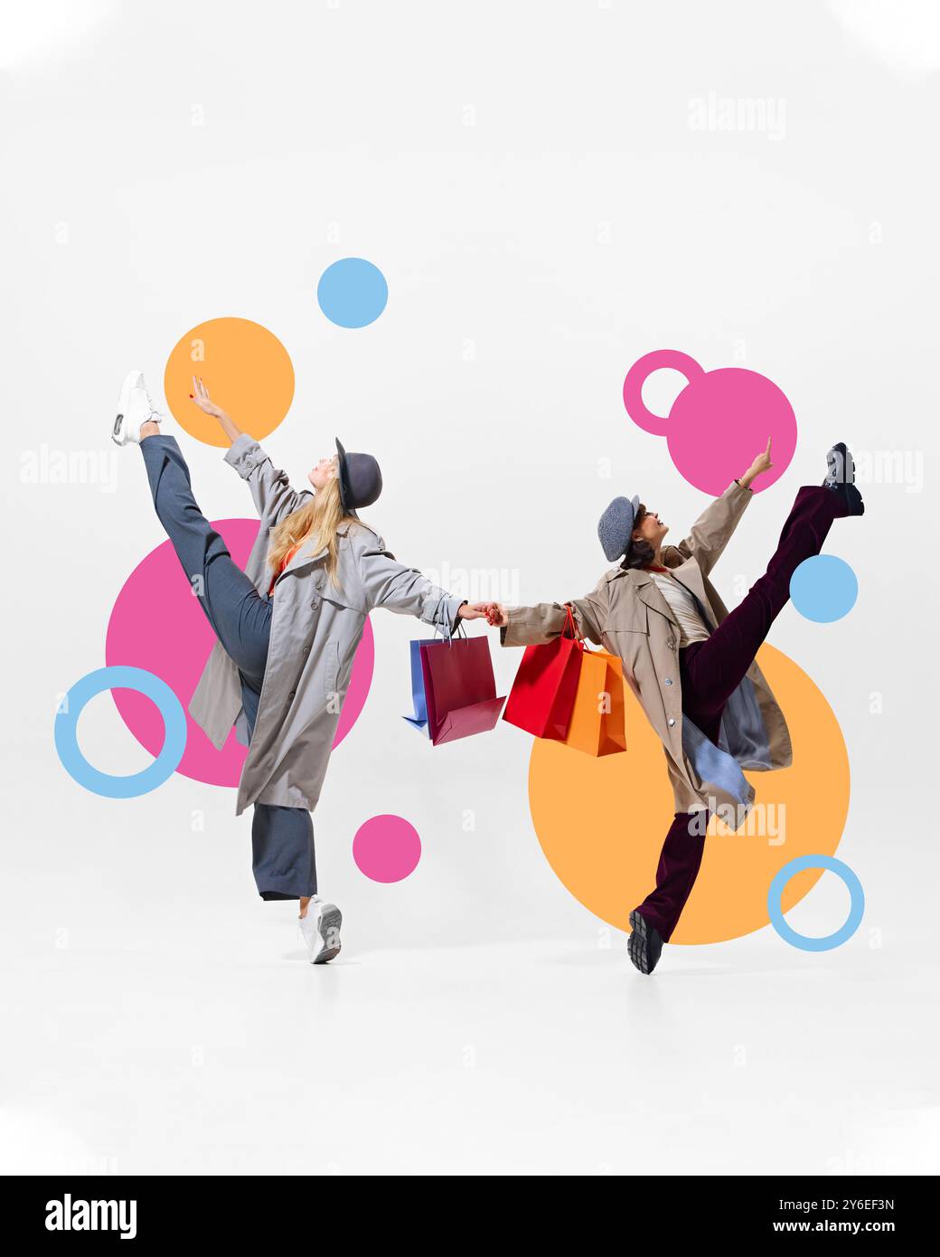 Two joyful woman leaping in sync, with shopping bags in hand, dancing ...