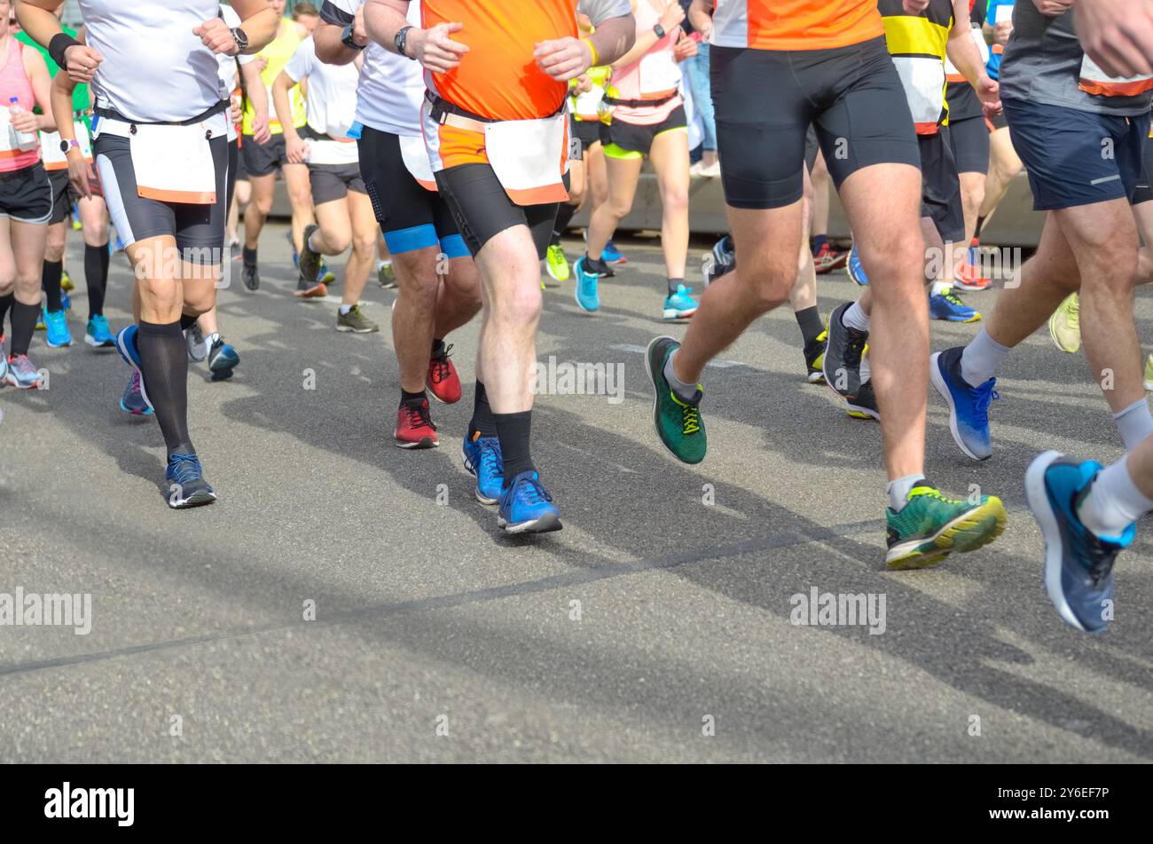 Marathon running race, many runners feet on road racing, sport ...