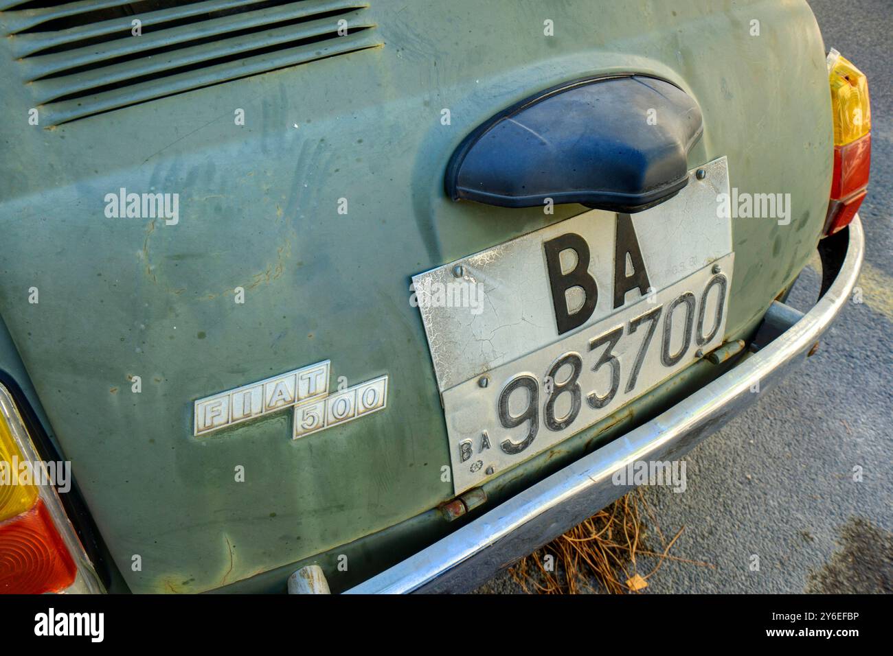 faded green vintage Fiat 500 bubble car parked in street in polignano a ...