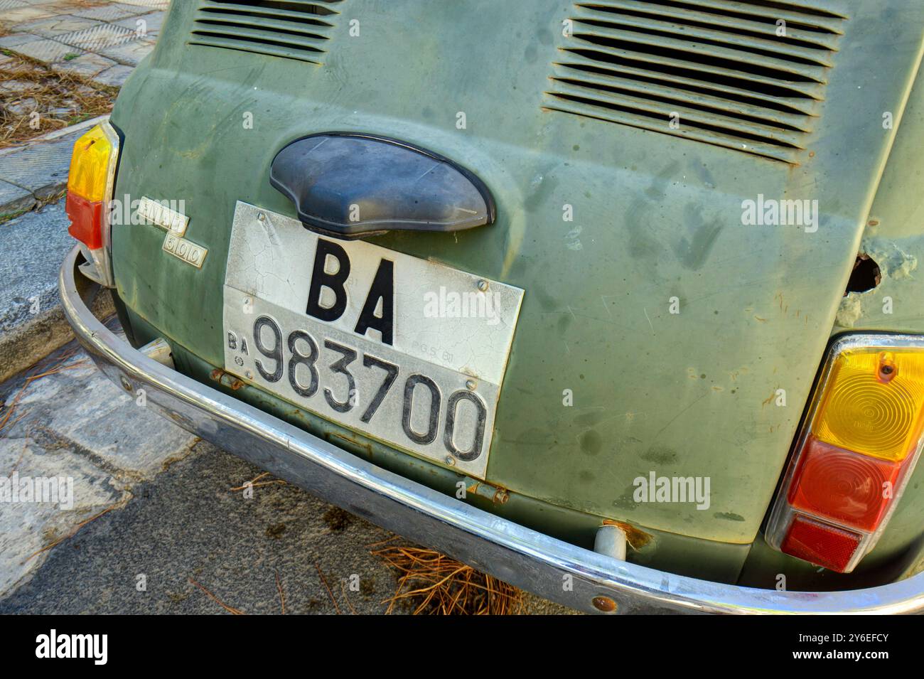 faded green vintage Fiat 500 bubble car parked in street in polignano a ...