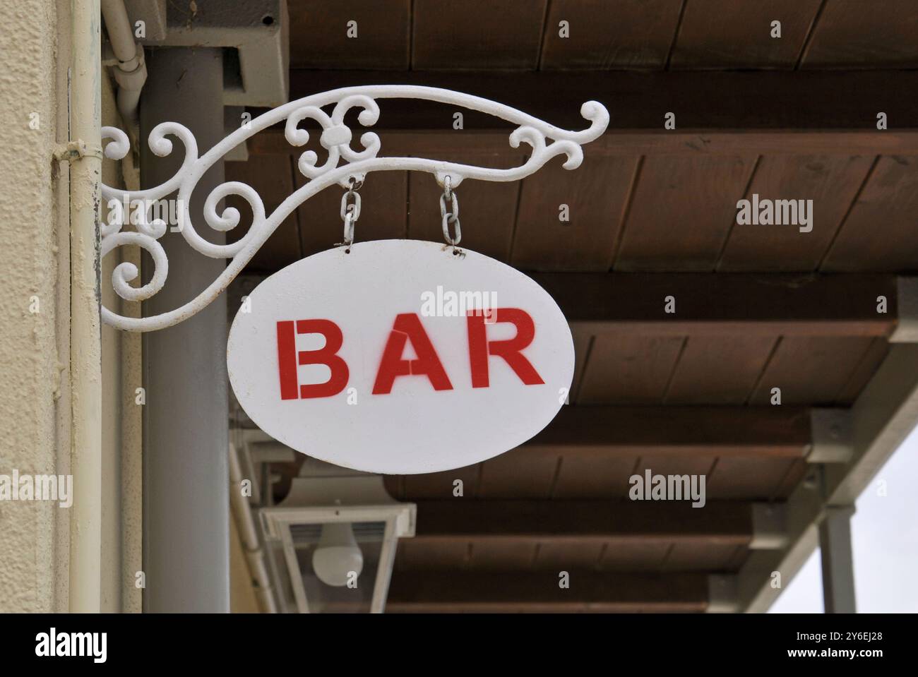 old-fashioned bar sign hanging on wall Stock Photo - Alamy