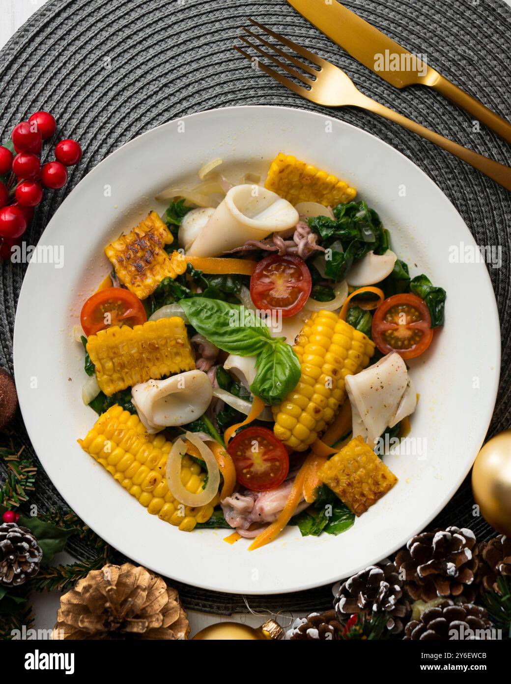 Mediterranean corn salad with squid. Top view table with Christmas decorations Stock Photo - Alamy