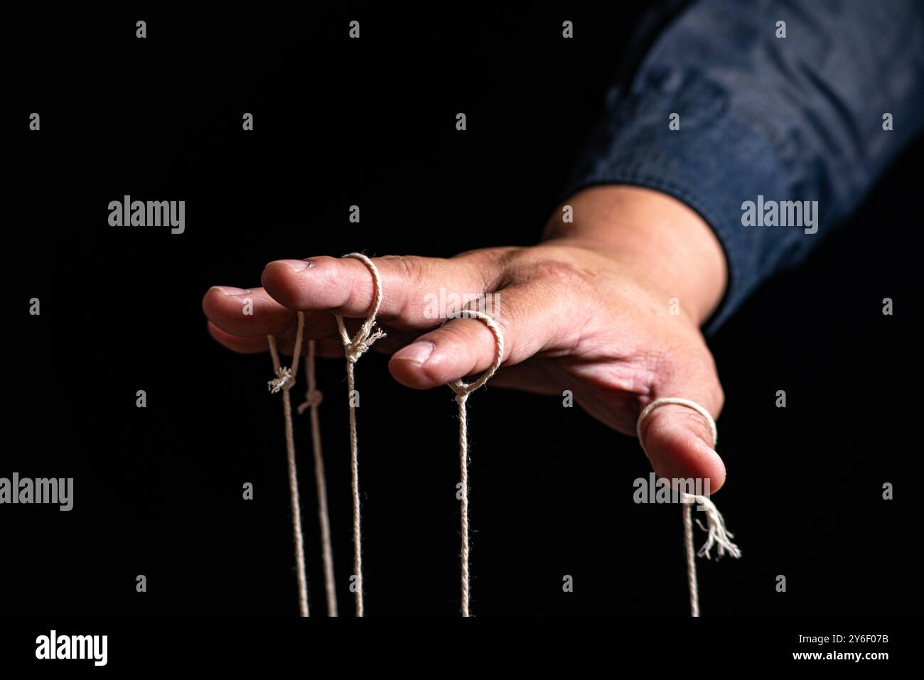 Close-up Of Man Controls The Puppet With Fingers. Man`s Hand Controls ...