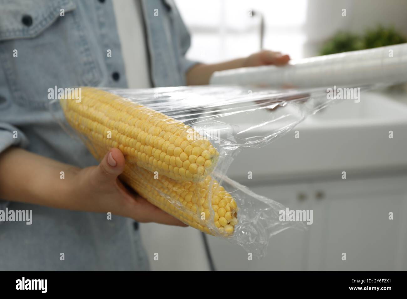 Woman wrapped in plastic wrap hi-res stock photography and images - Alamy