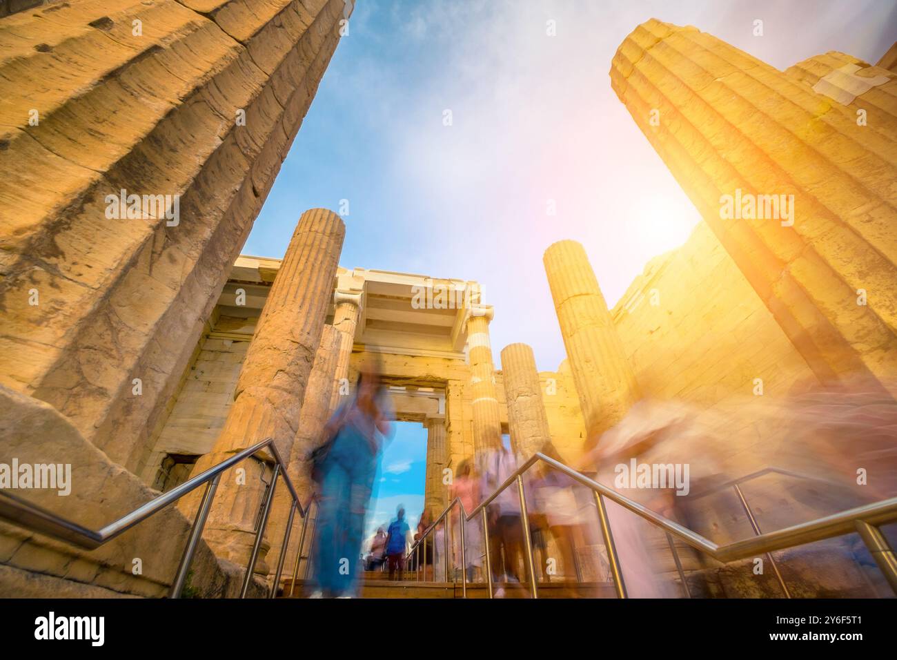 Tourists pass through the Propylaea monumental entrance to the ...