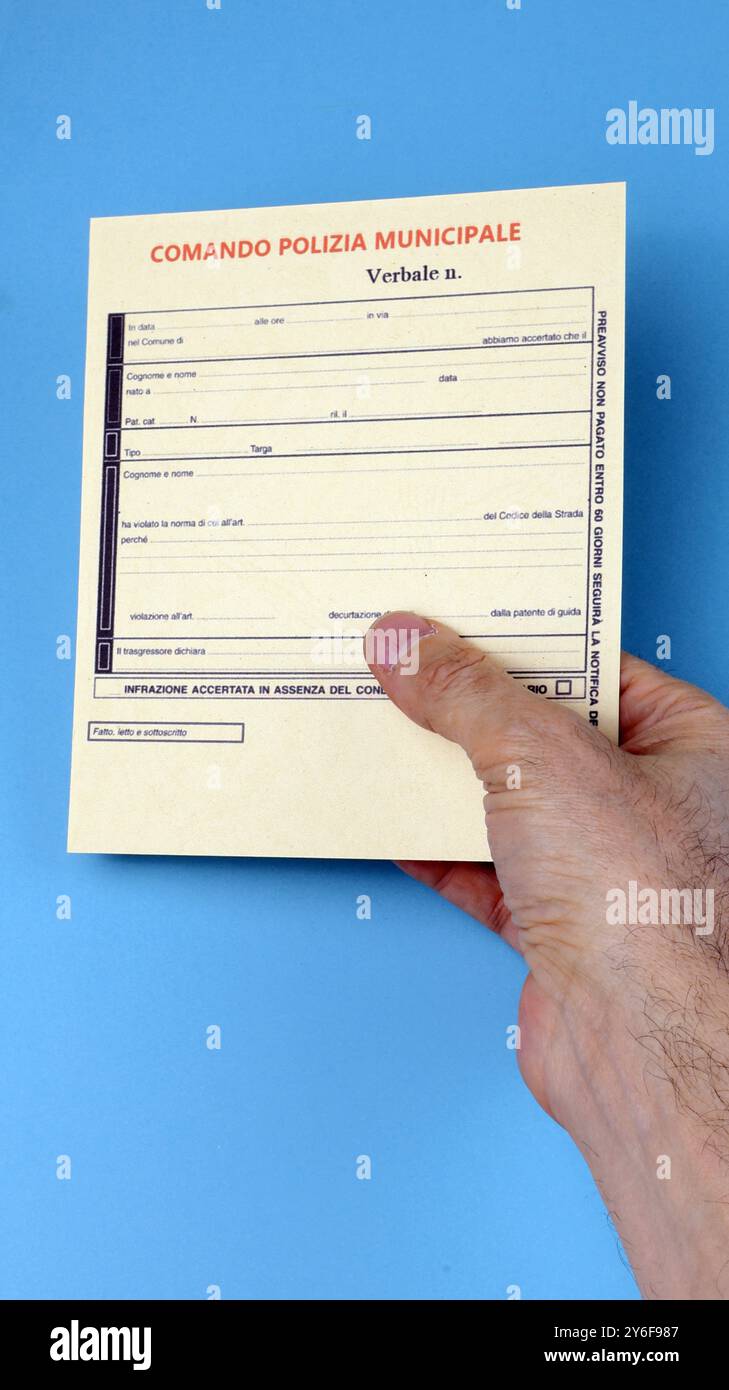 Traffic ticket violation Police crime in Italy, man hand holds blank ...