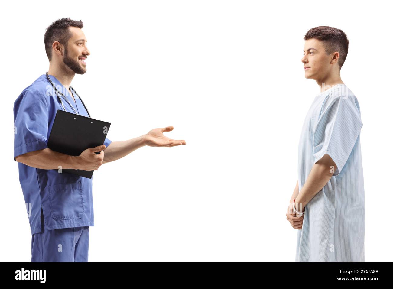 Profile shot of a male patient in a hospital gown listening to a ...