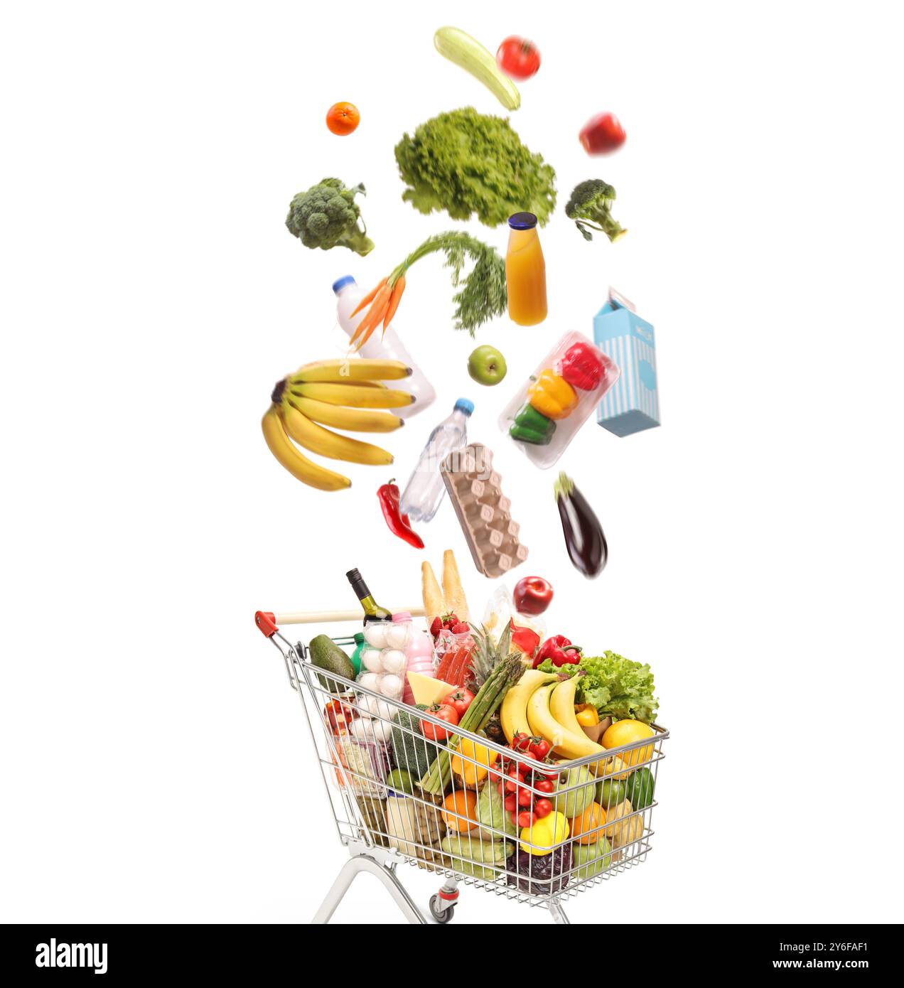 Different products falling into a shopping cart isolated on white ...