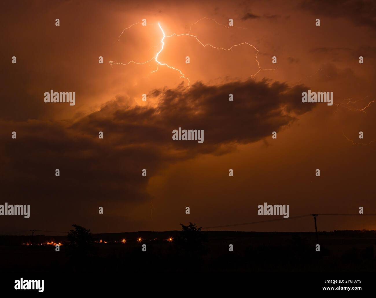 A dramatic scene of a lightning bolt striking during a thunderstorm ...