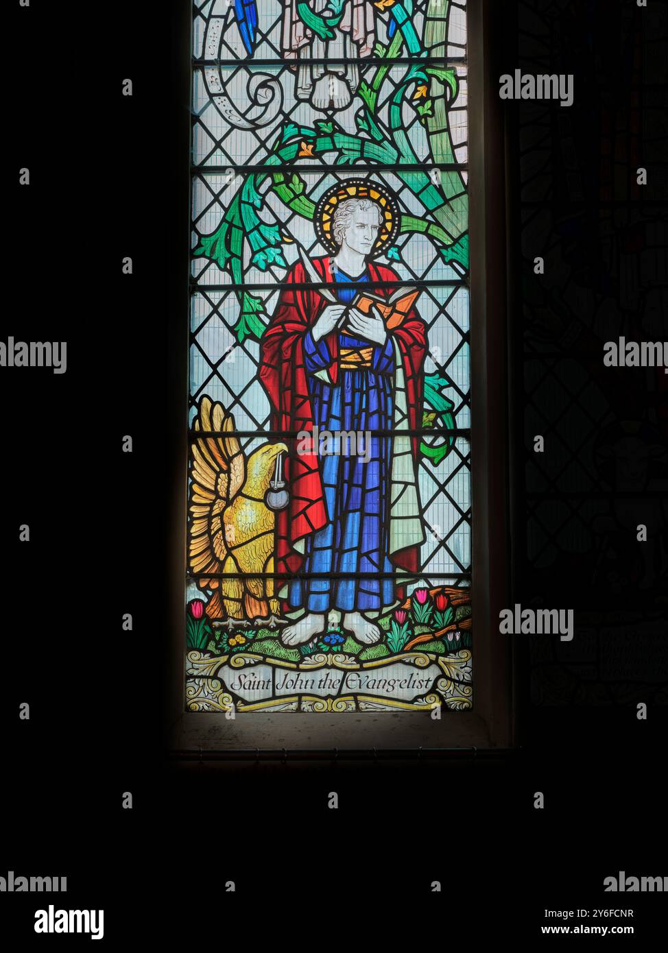 Stained glass window, of St John the Evangelist, in the Church of the ...