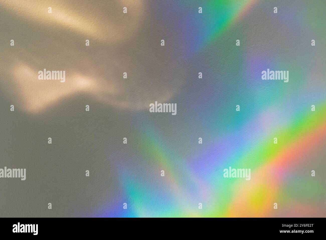 Defocused rainbow light reflection on white building. Sunlight flare ...