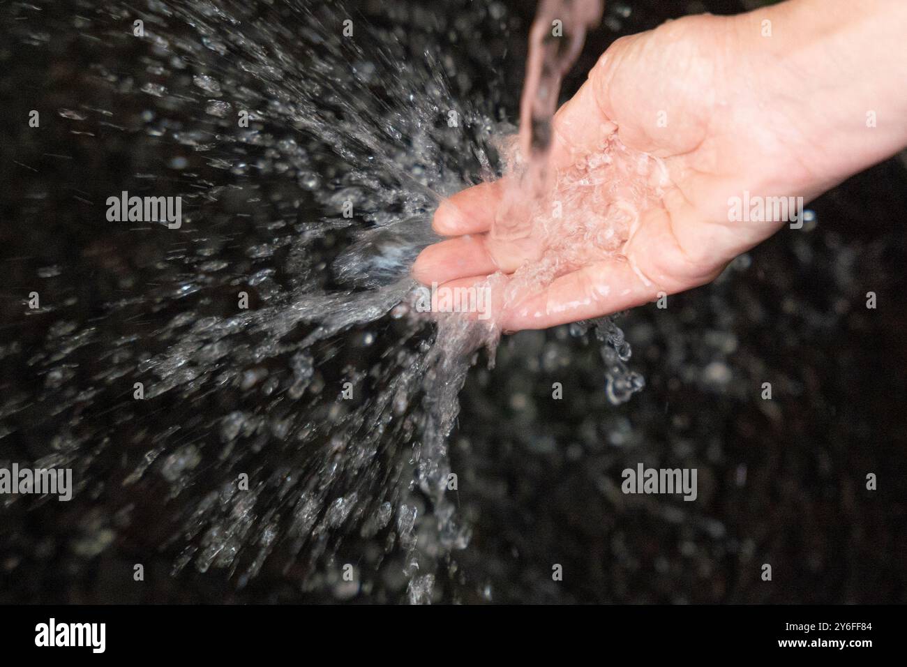 Human hands with falling water hi-res stock photography and images - Alamy