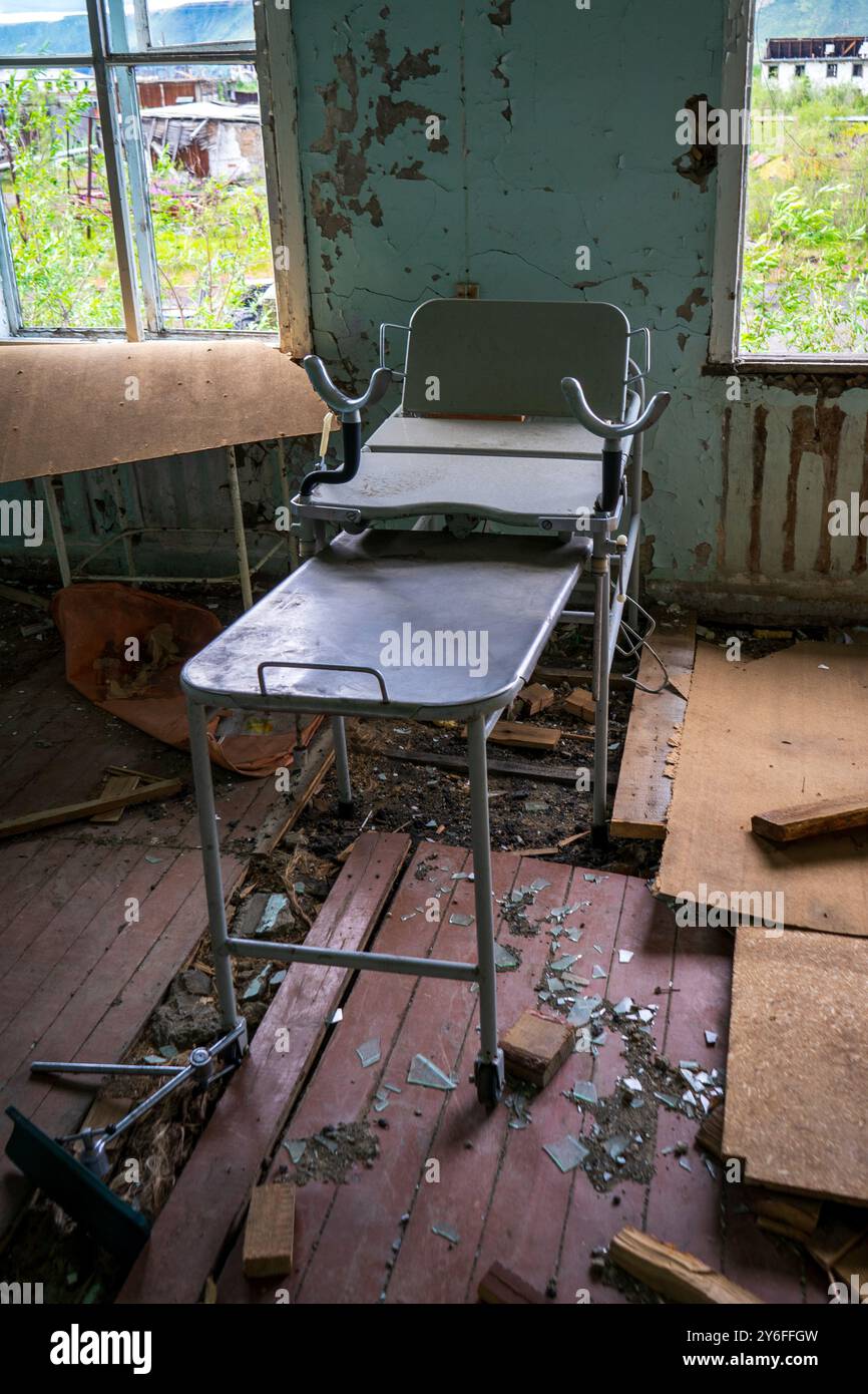 Gynecological examination table in an abandoned destroyed hospital ...