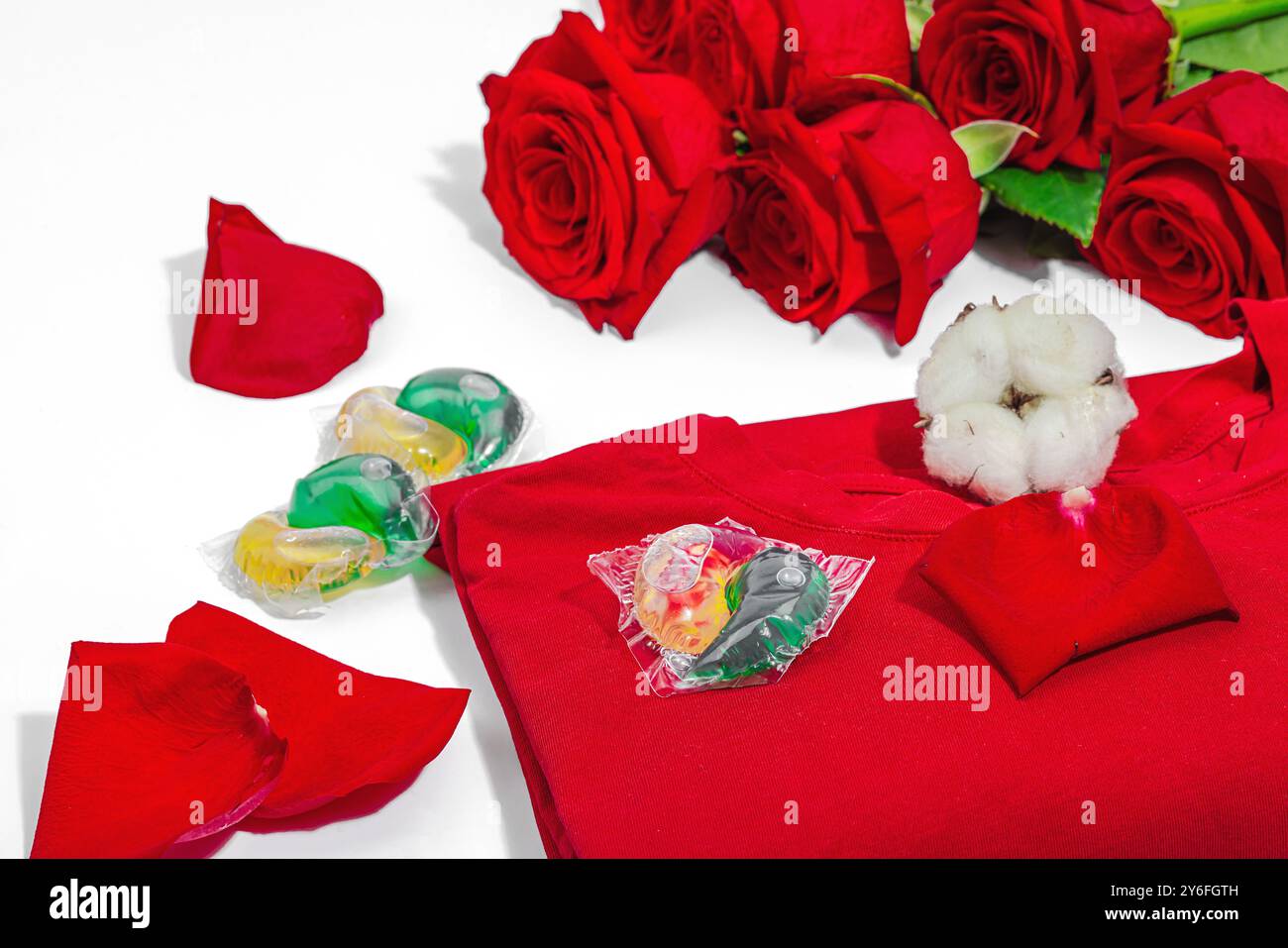Eco-friendly clothes cleaning, capsules for machine washing. Bright red ...