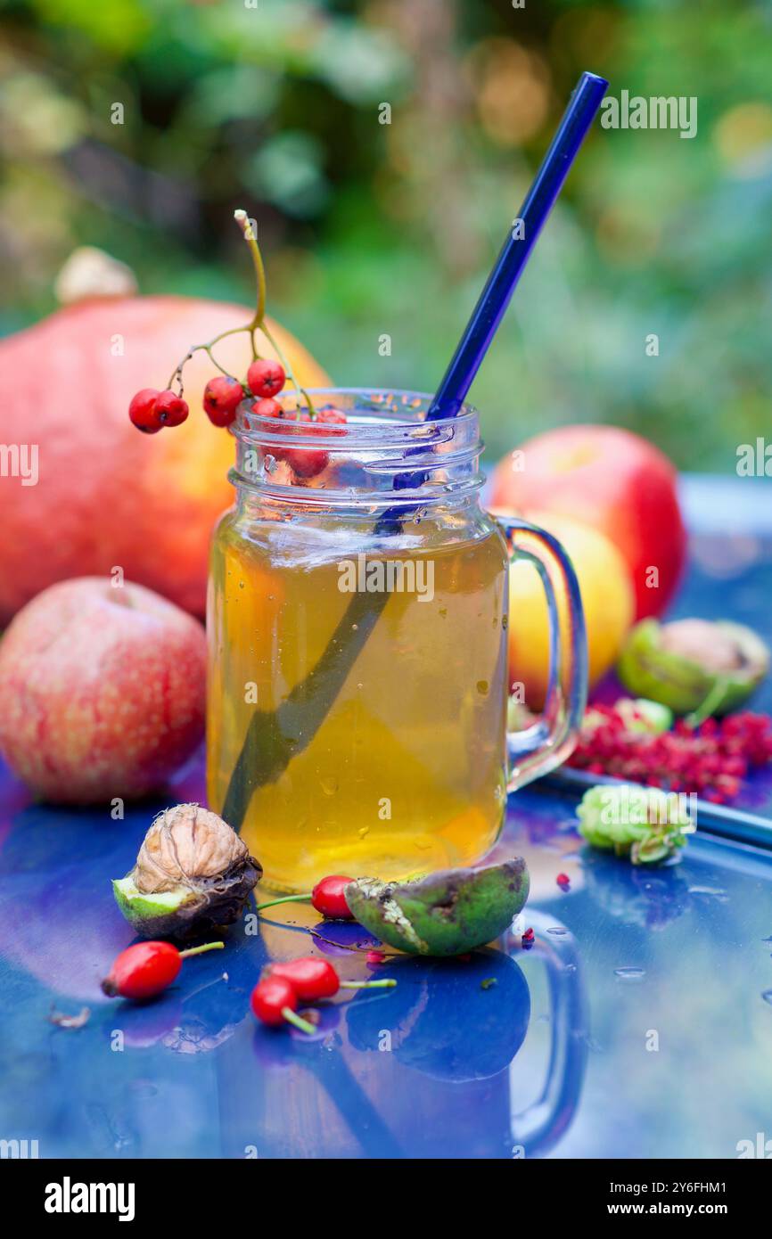 A glass of apple juice, a straw, apples Stock Photo - Alamy