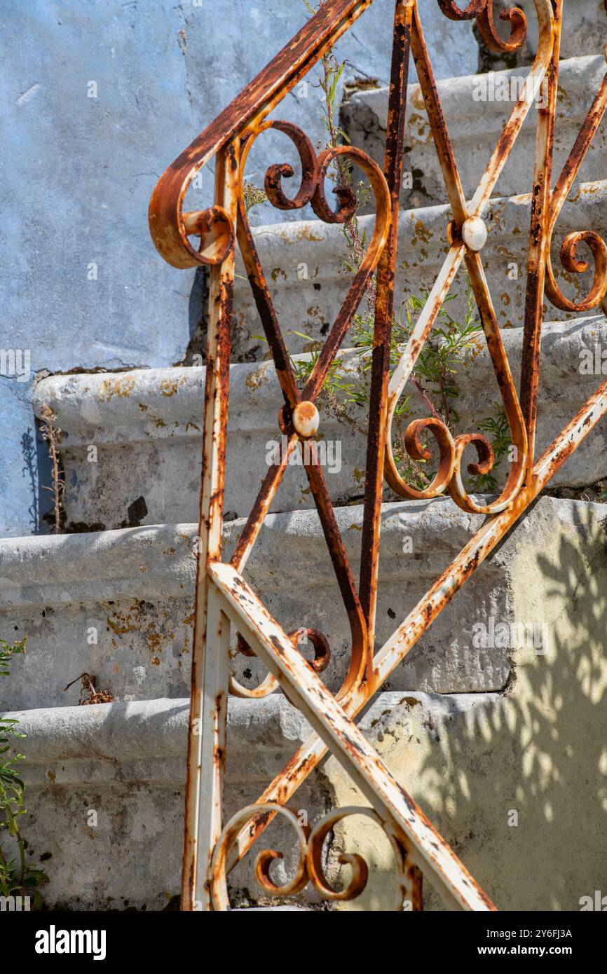 abstract of rusty railings and stone steps, stone stairs and corroded ...
