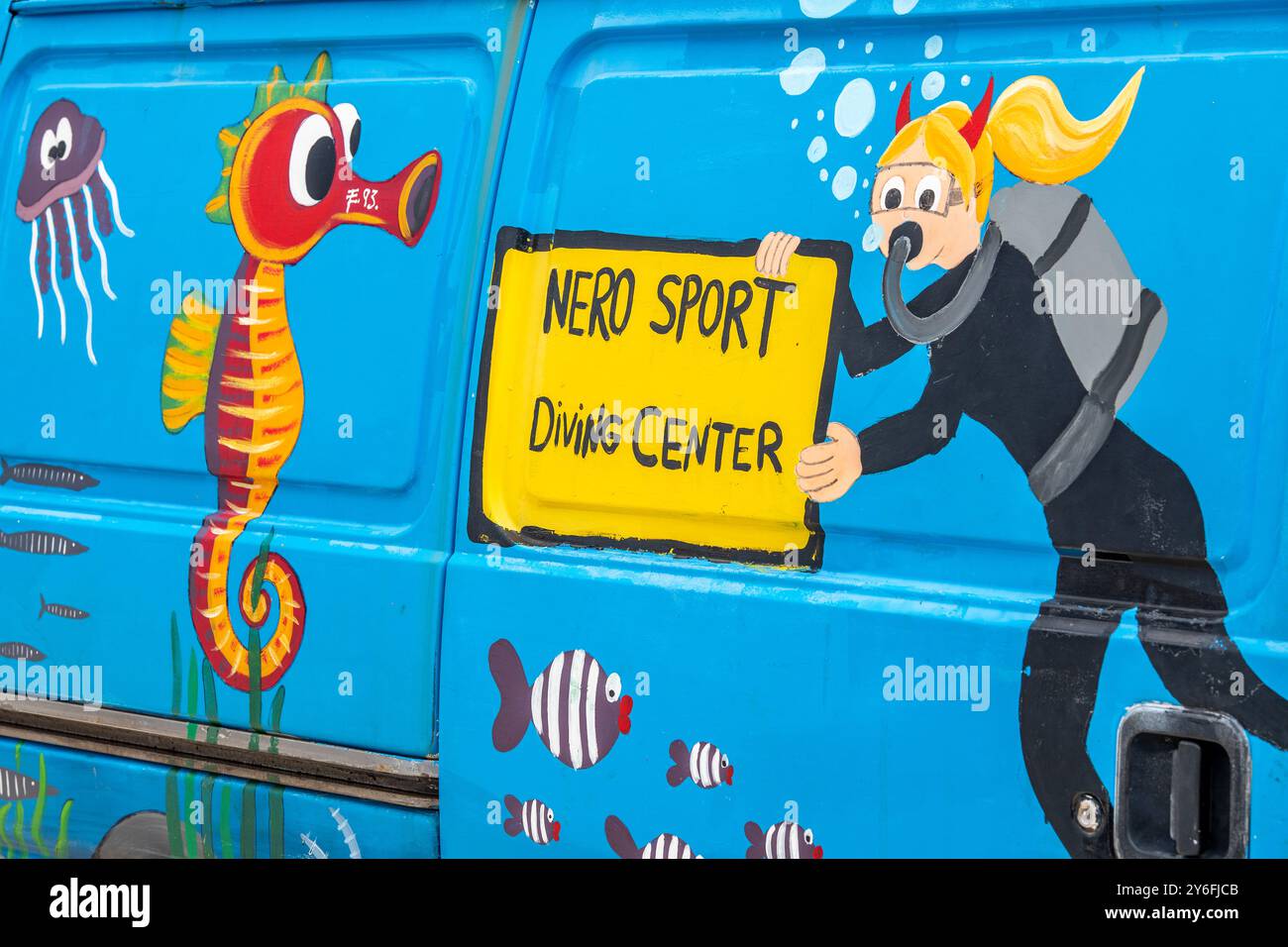 cartoon style painting on side of van depicting divers and advertising ...