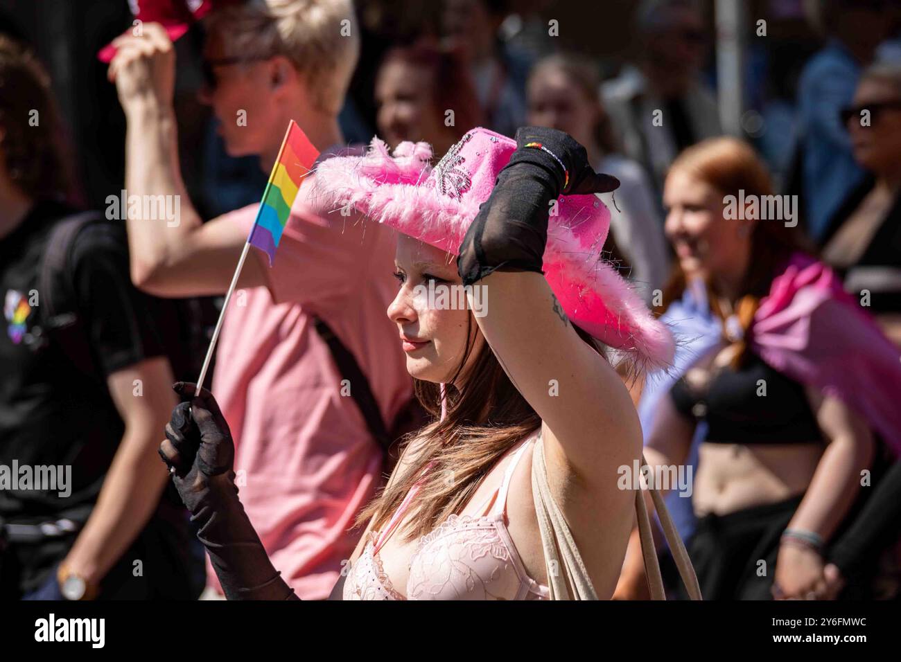 Young woman wearing pink bra and pink cowboy hat at Helsinki Pride 2024 ...