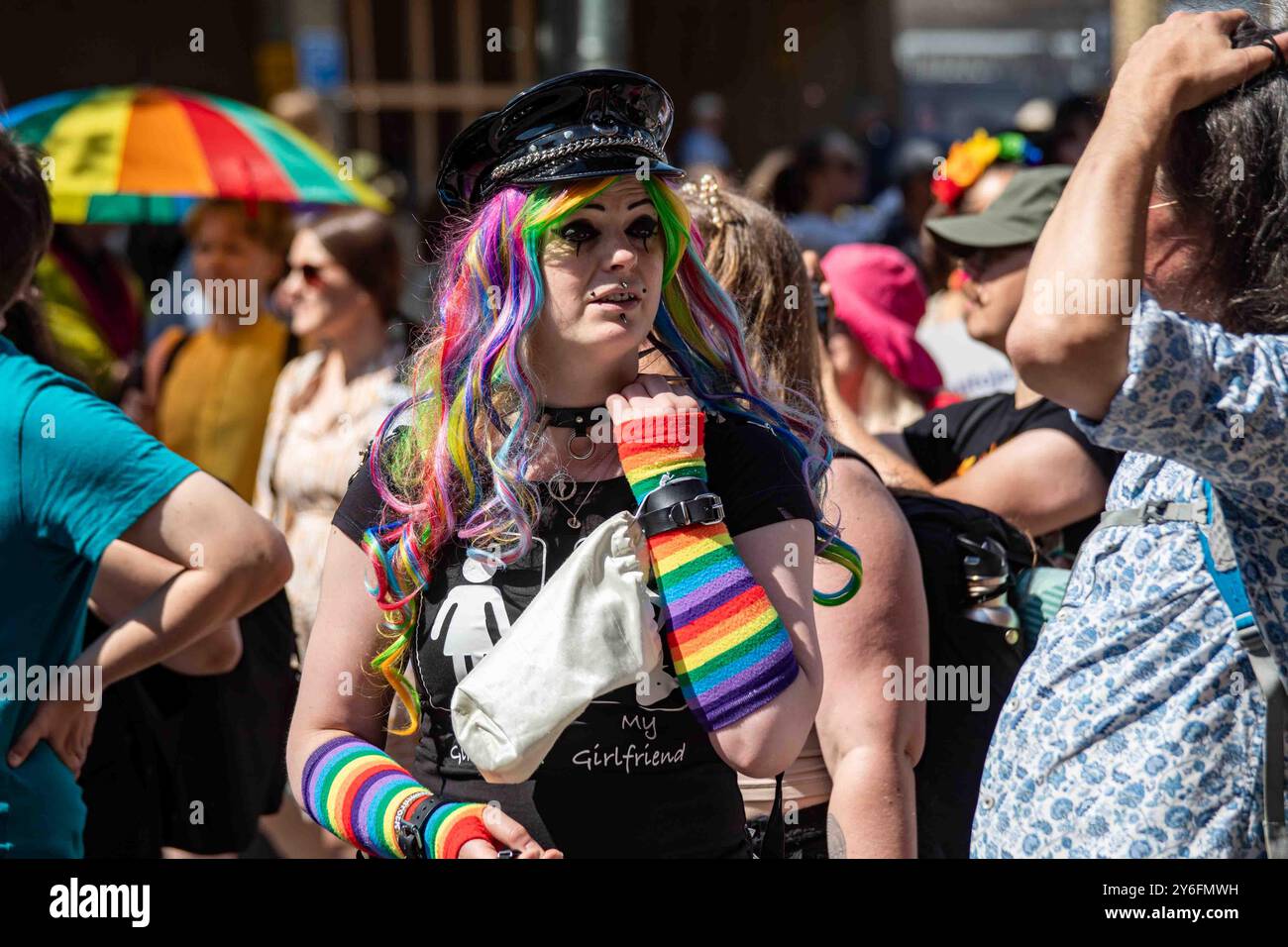 Woman with leather cap and colorful wig at Helsinki Pride 2024 Parade on Mannerheimintie in ...