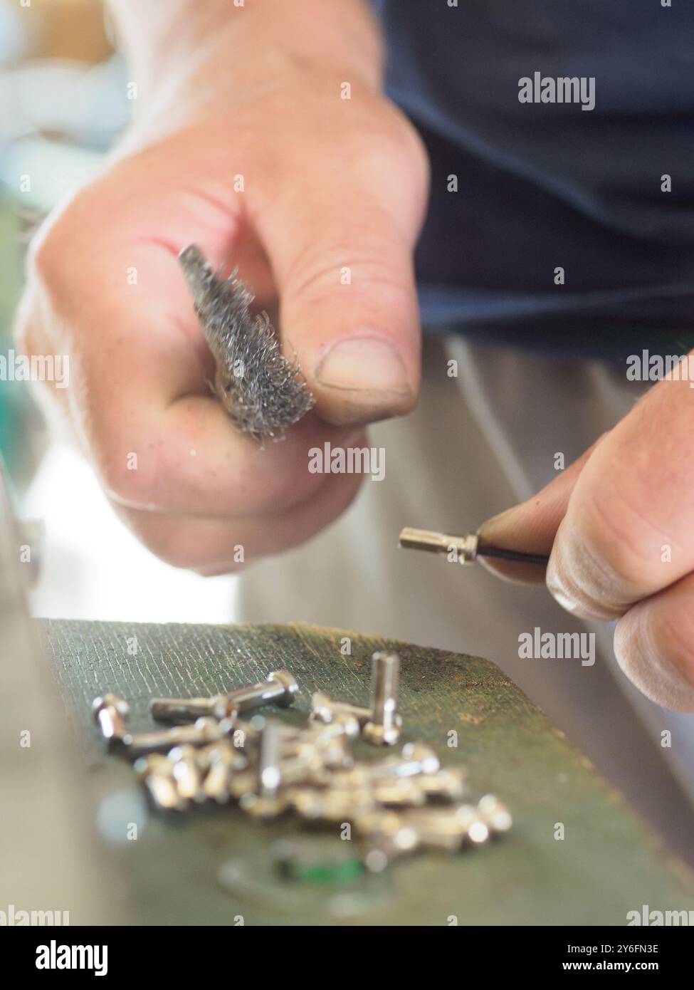 Locksmith crafting a new house key with precision and dedication at his ...